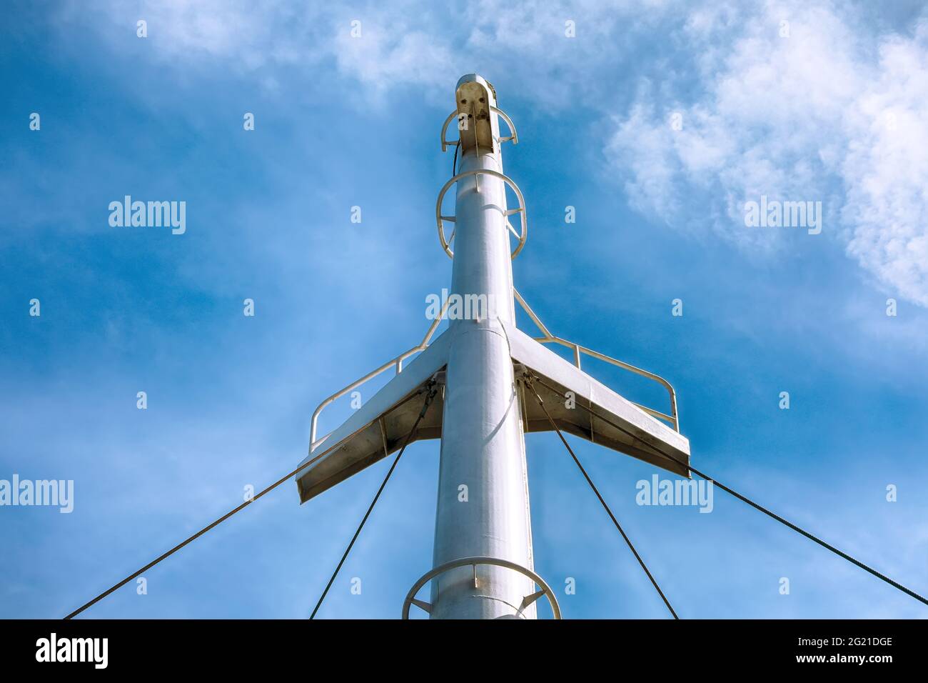 The mast of a modern ship against the background of the blue sky. Mast ...