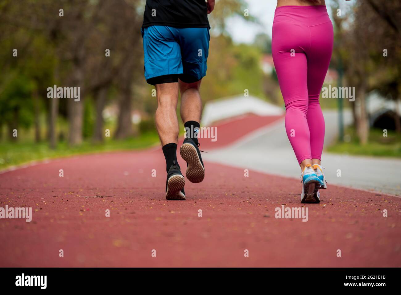 Portrait of a young happy couple racing each other and having some fun ...