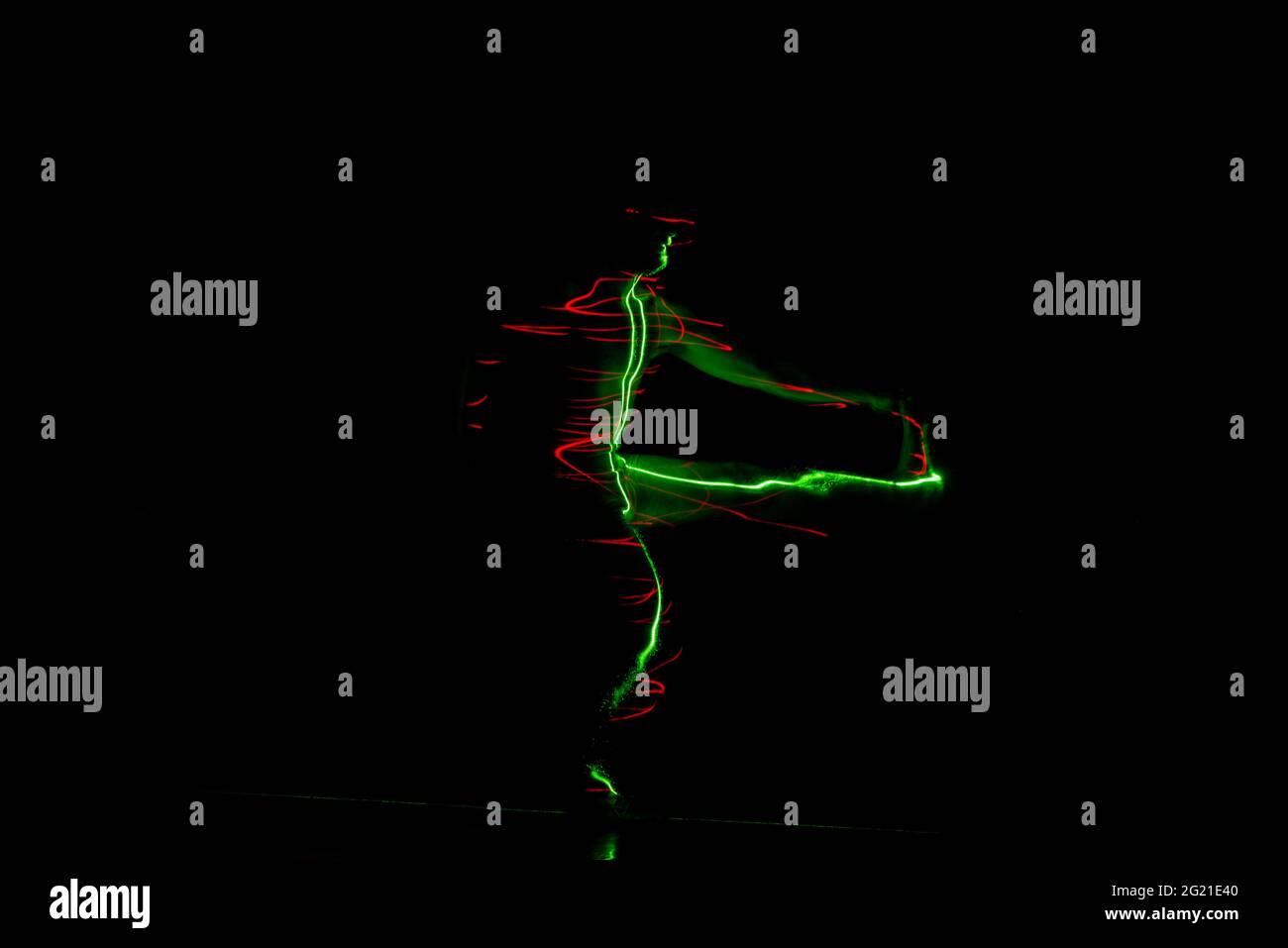 Shape of a contemporary dancing performer in a dance laser show Stock Photo - Alamy