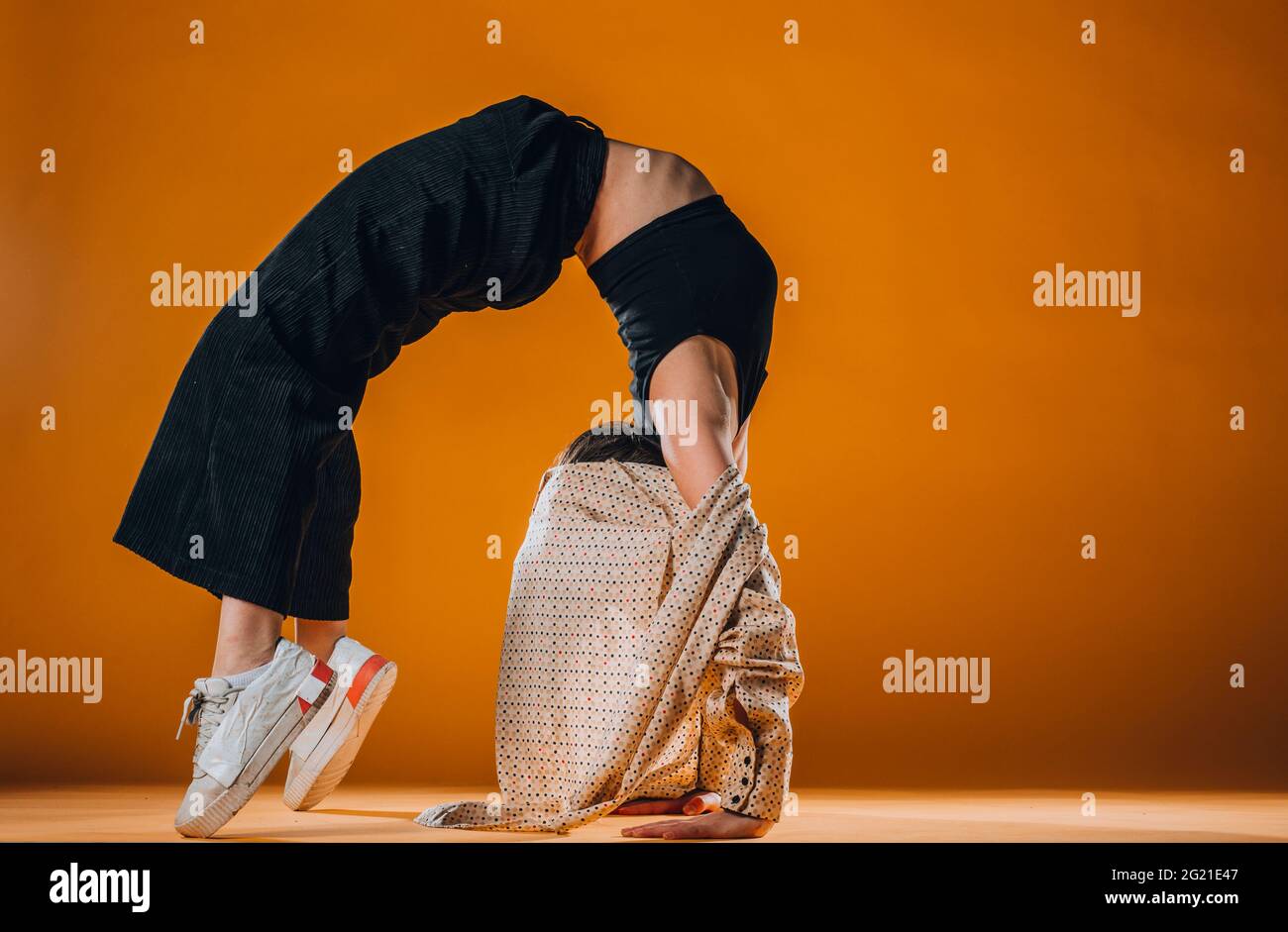 Dance moves performed by an acrobatic flexible female dancer Stock ...