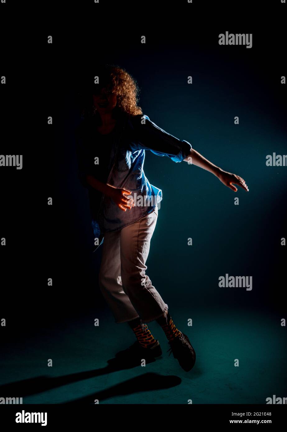 Modern dancing performer jumping exercising during a dance practice ...