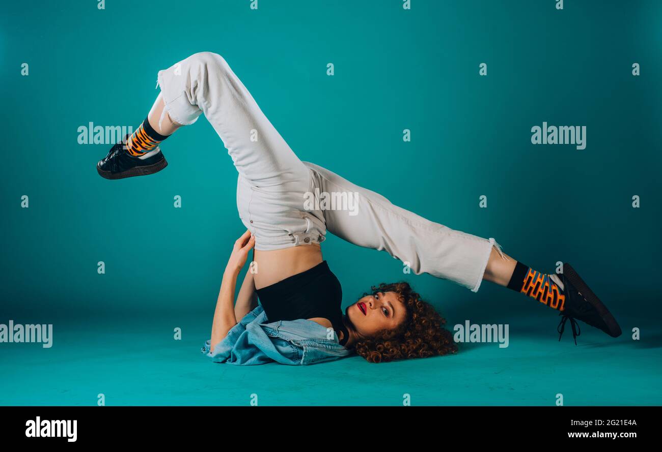 Young dance performer practicing a contemporary dance movement Stock ...