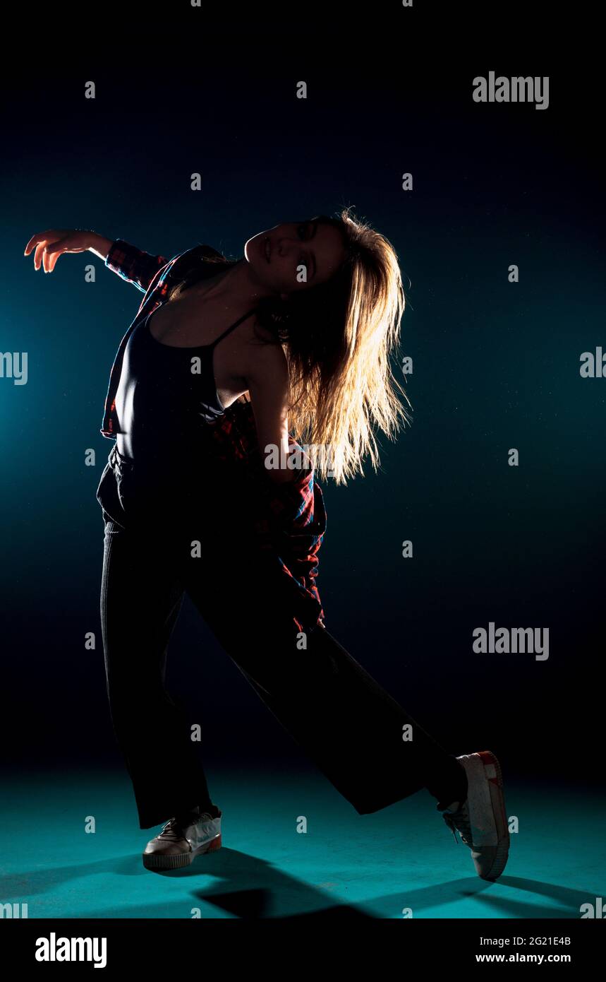 Contemporary dancing performer in a dance practice class isolated on ...