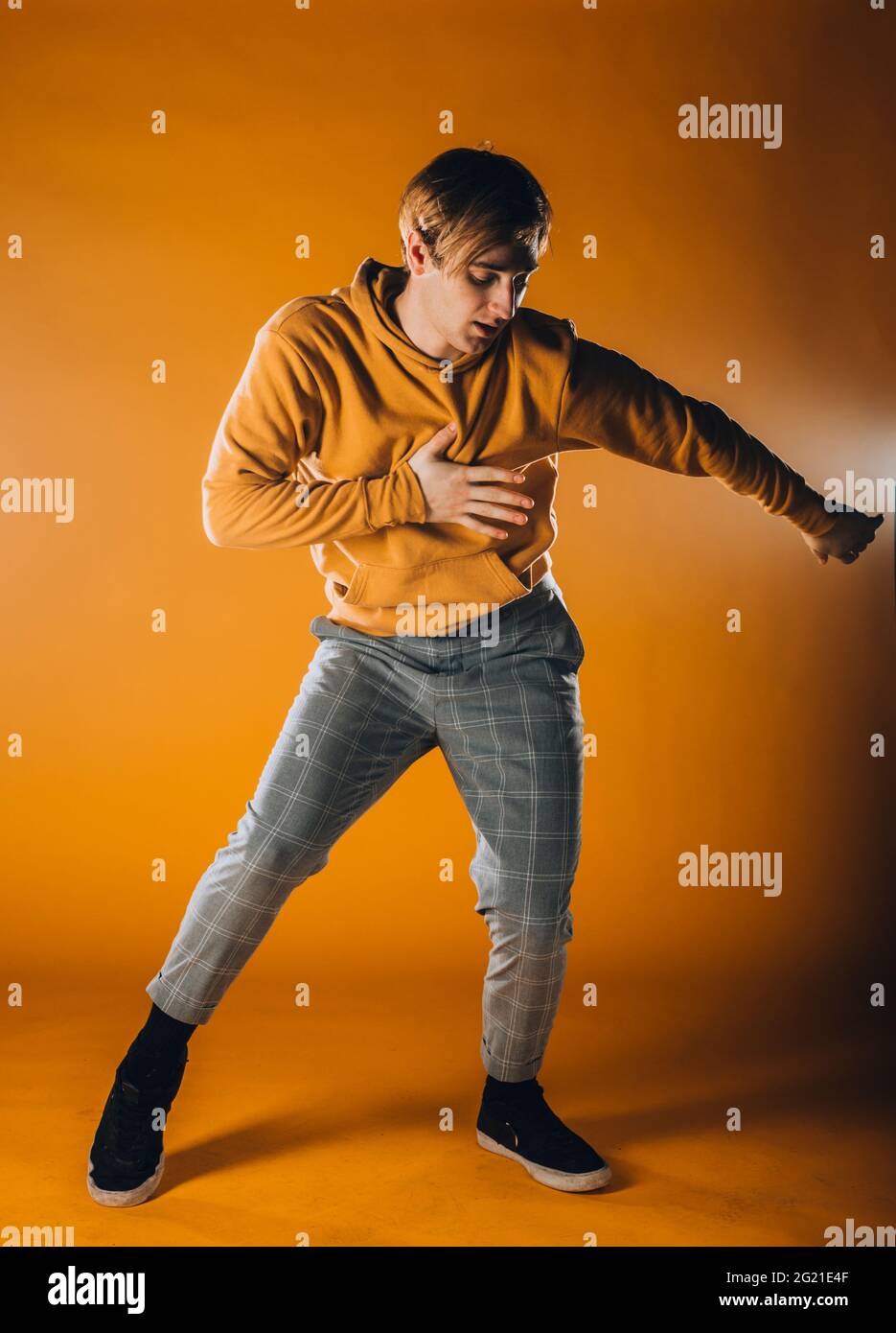 Young man performing acrobat training hi-res stock photography and ...