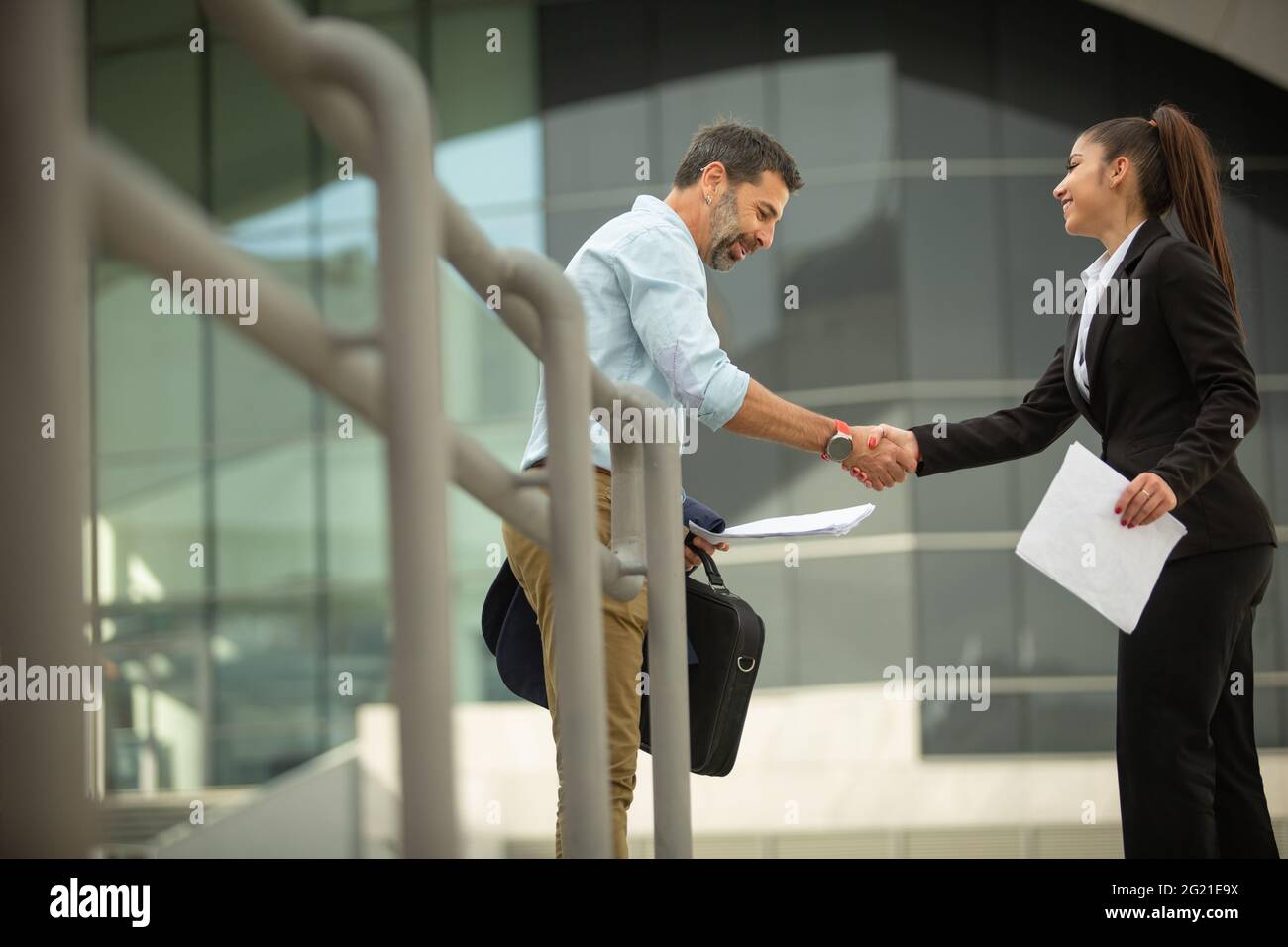 Two business people are making a deal about the plans for the company ...