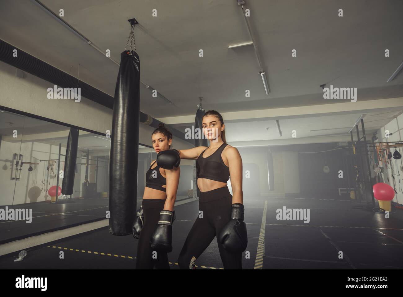 Female kickboxer doing a side kick Stock Photo - Alamy