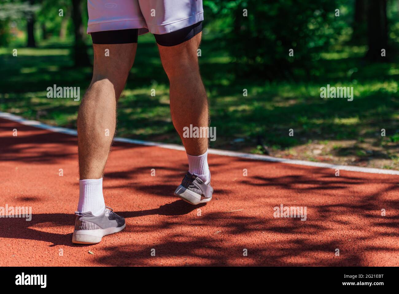 Close-up photo of male running shoes on a race track in the park Stock ...