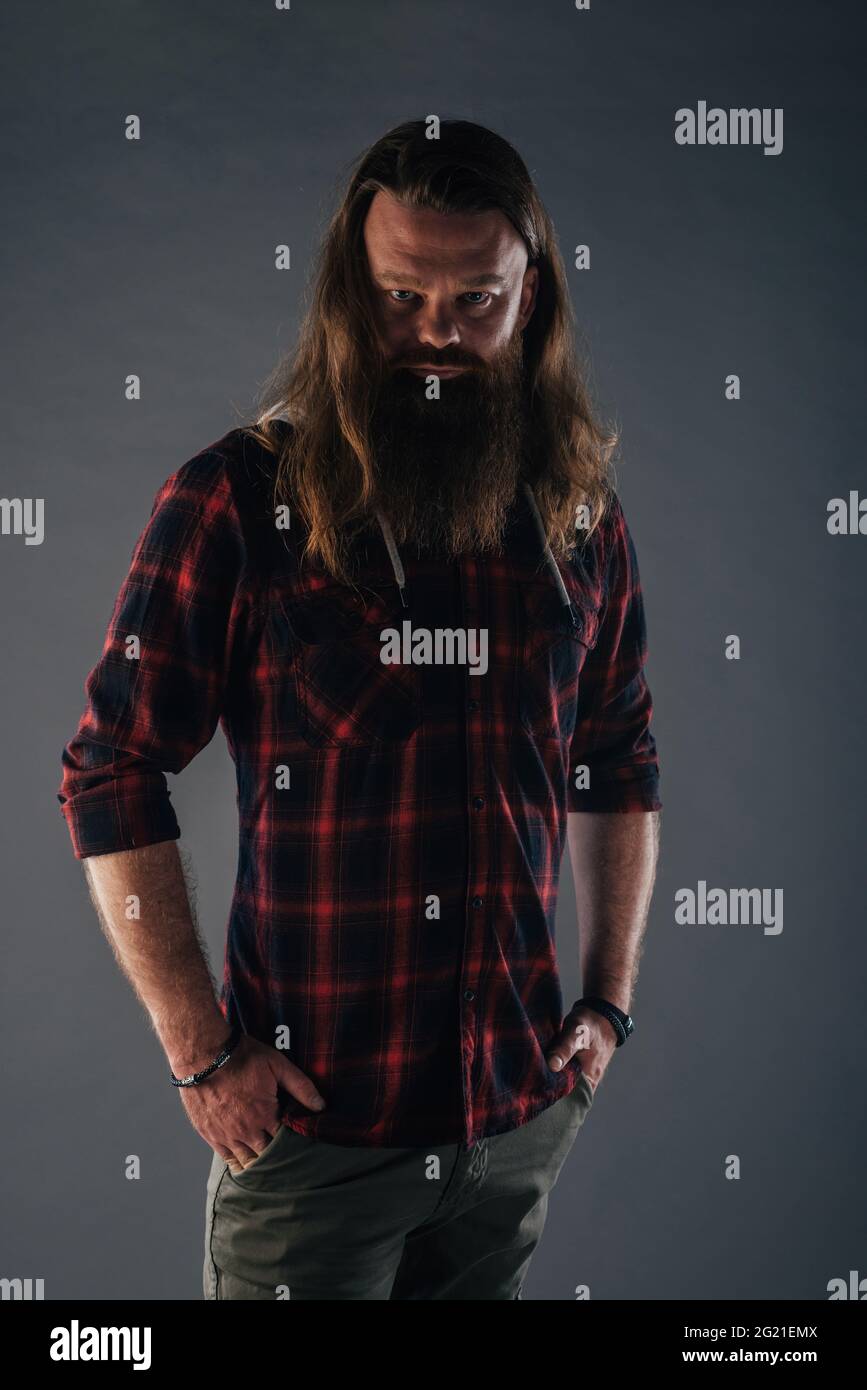 Beautiful strong nordic man with stylish hairstyle and beard on a ...