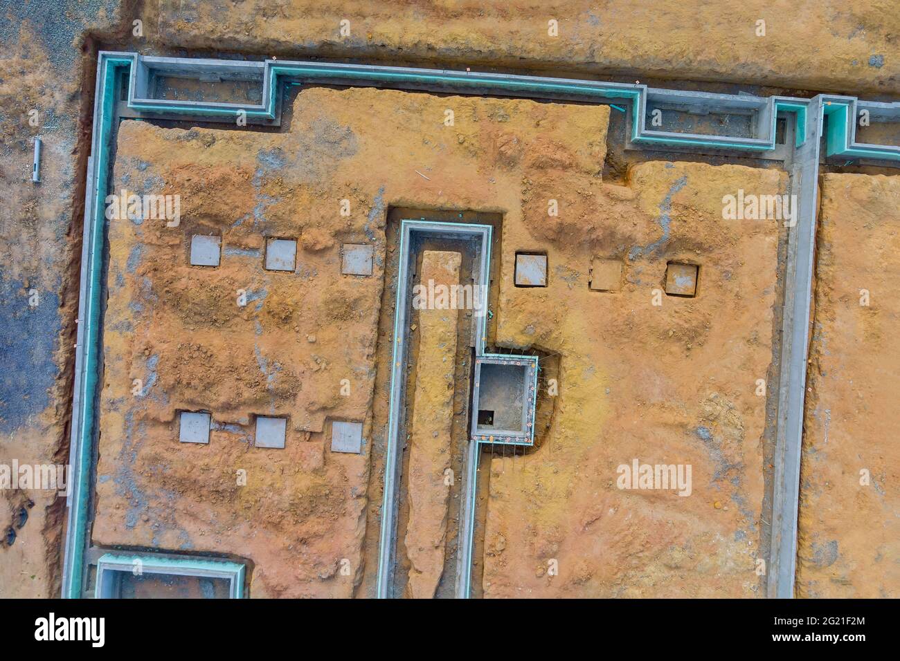 Building construction real property of trenches dug in ground and ...