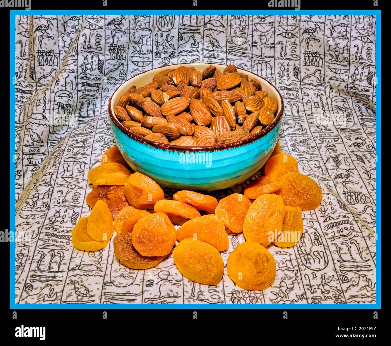 Almonds and Apricots with blue bowl Stock Photo - Alamy