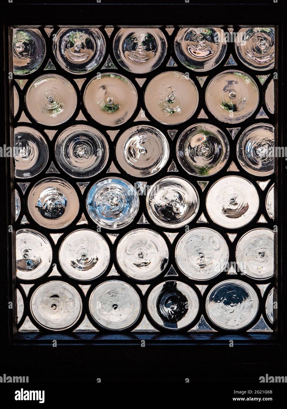 Glass bottle circular window Stock Photo - Alamy