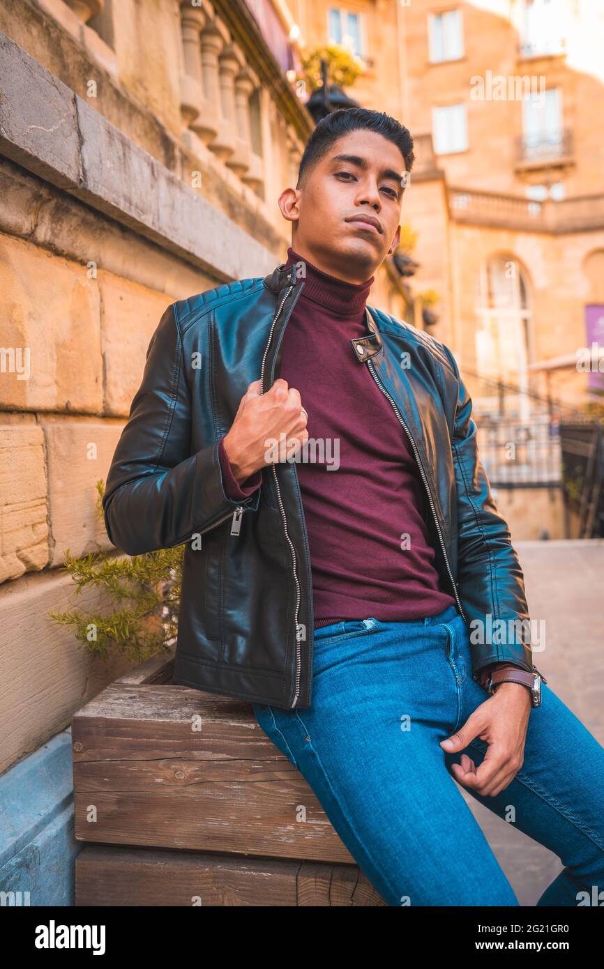 Vertical shot of a Hispanic male posing in a city Stock Photo - Alamy