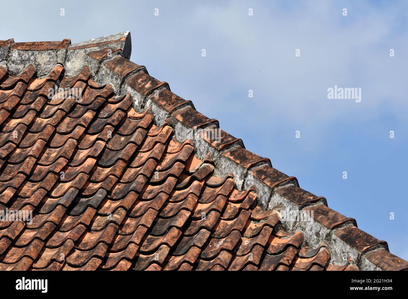 Traditional tile roof in a village in Indonesia with blue sky Stock ...