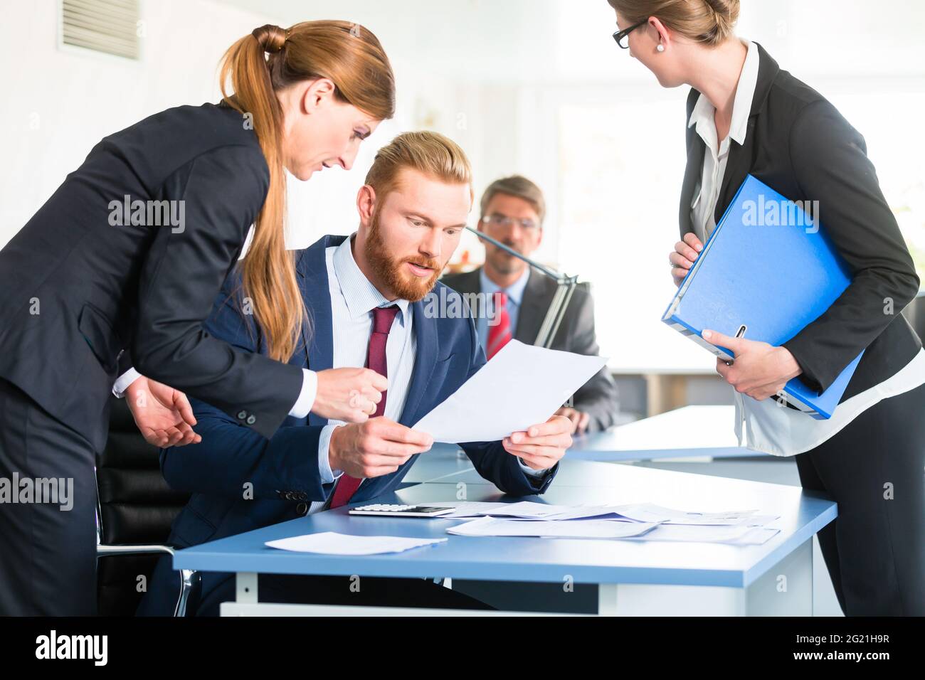 Office workers checking documents hi-res stock photography and images ...