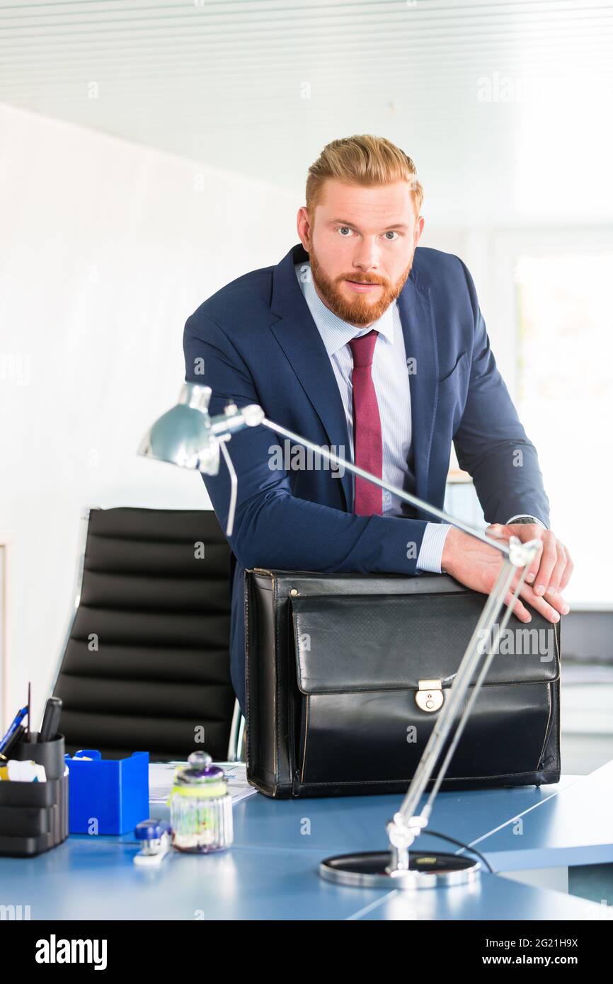 Man standing over desk hi-res stock photography and images - Alamy