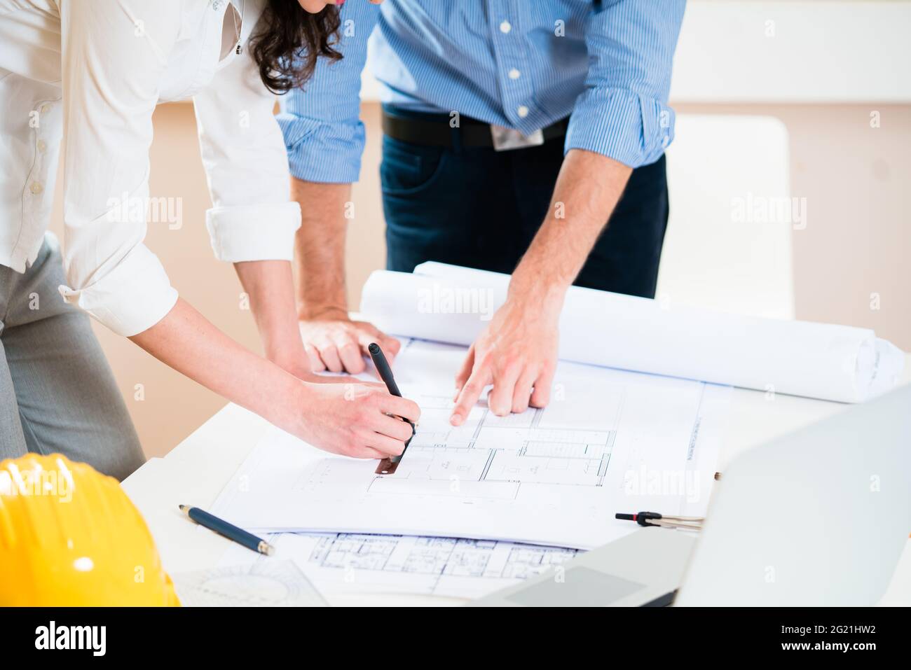 Civil engineers in discussion of construction plans for building in ...