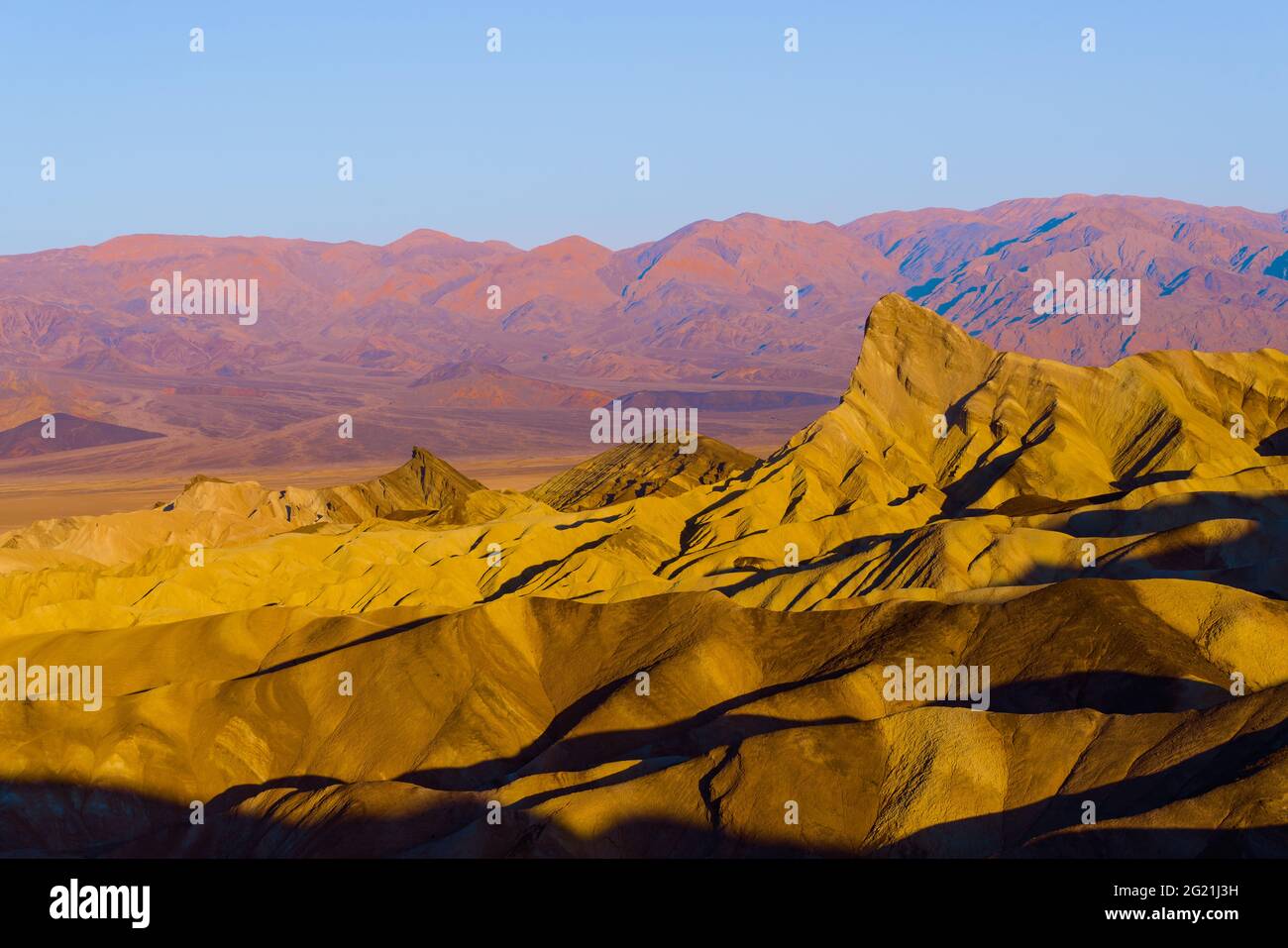 Manly Beacon in first rays of the sun. Zabriskie point sunrise, Death ...