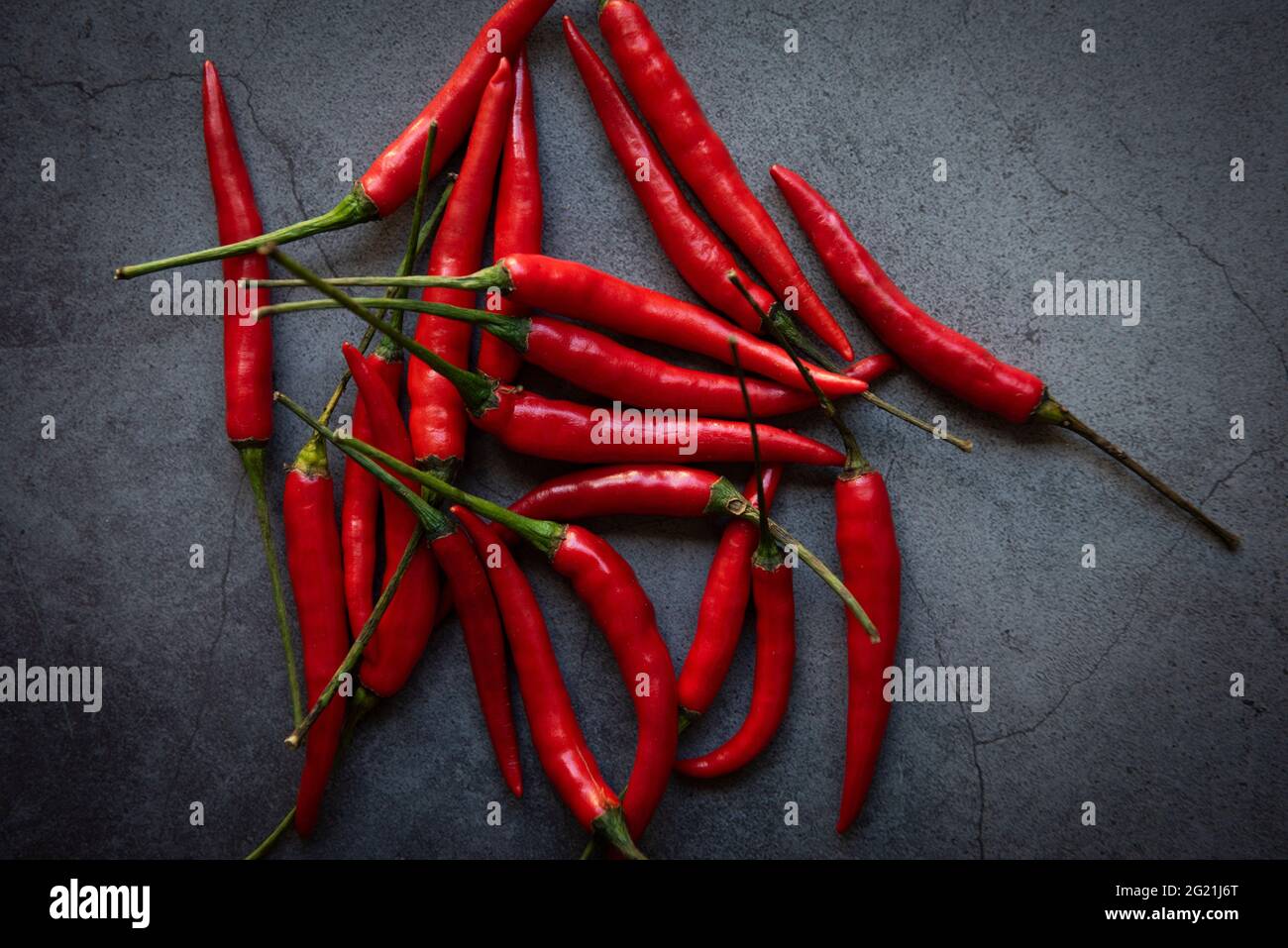 Hot and spicy chili pepper on dark background, Red chilli from Thailand ...