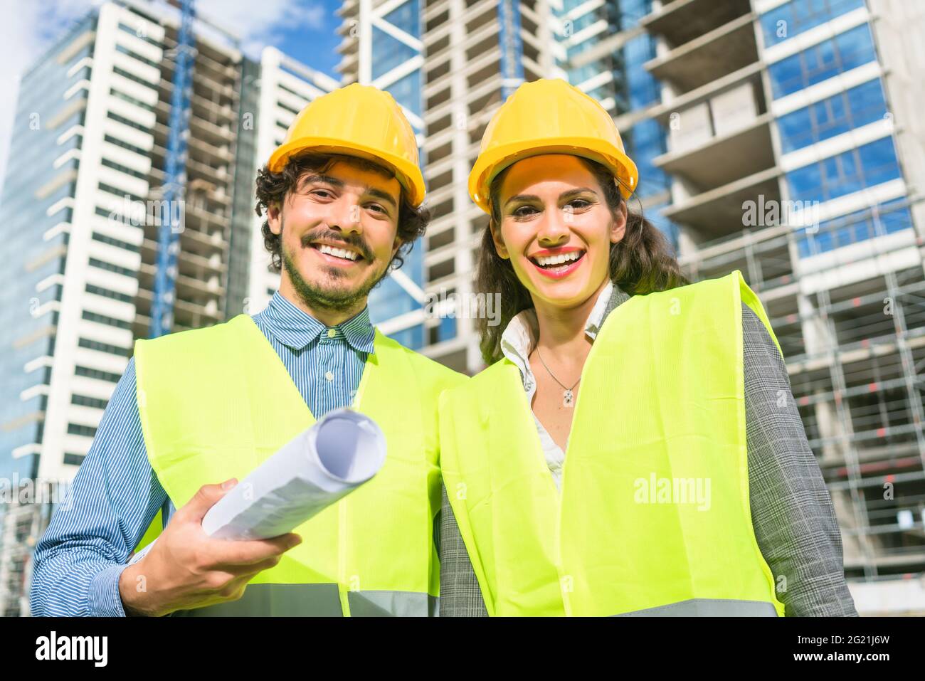 Construction engineers supervising progress of construction project ... Construction engineers supervising progress of construction project ...