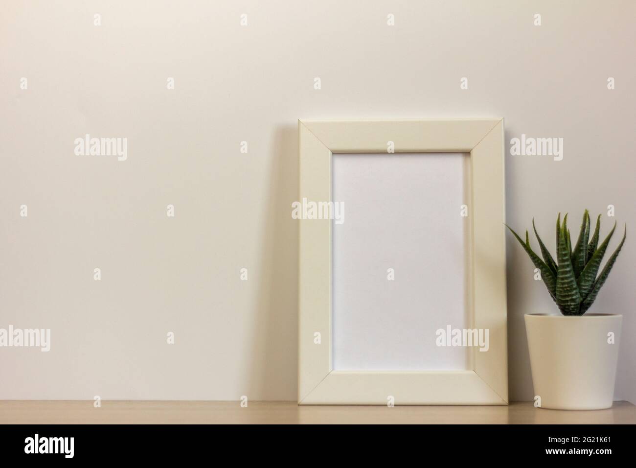 An empty photo frame on a table or shelf with a copy of the space Stock ...