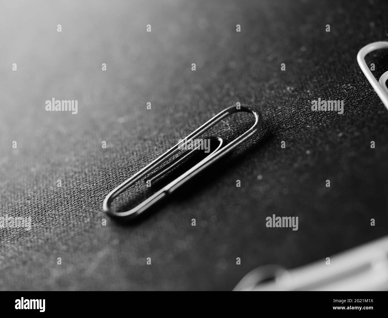 Paper clip on the table Stock Photo - Alamy