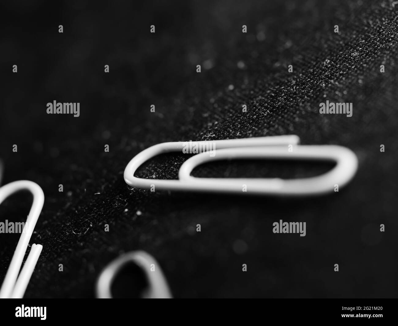 Paper clip on the table Stock Photo - Alamy
