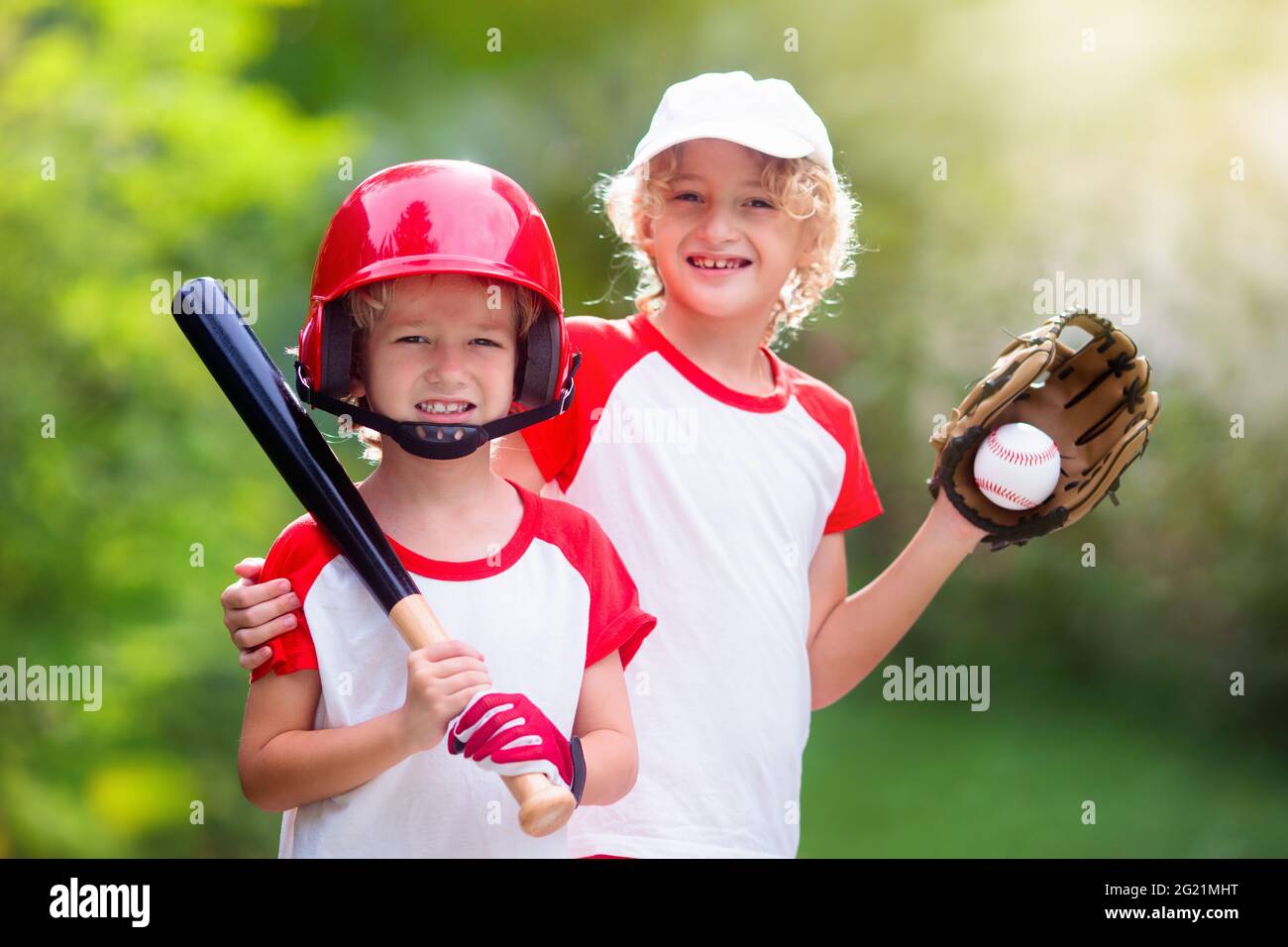 Kids play baseball. Child with bat and ball. Outdoor activity for ...