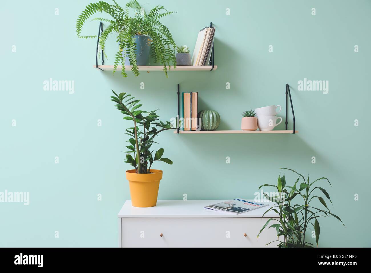 Interior of modern room with chest of drawers and shelves Stock Photo ...