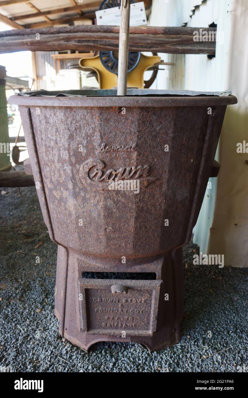 A vintage old rusty, textured cast iron copper with a copper insert for ...