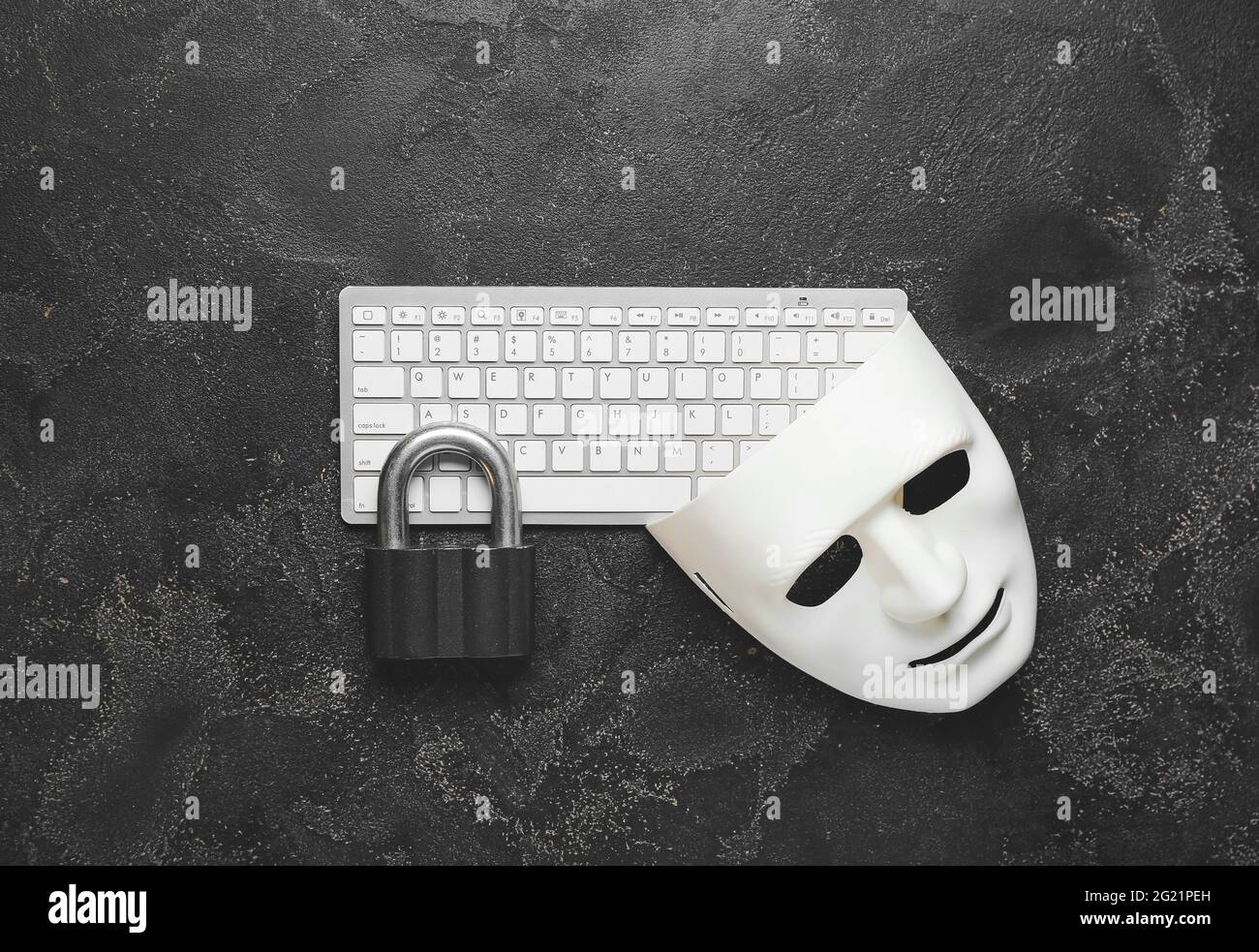 PC keyboard, mask and lock on dark background. Hacking concept Stock ...