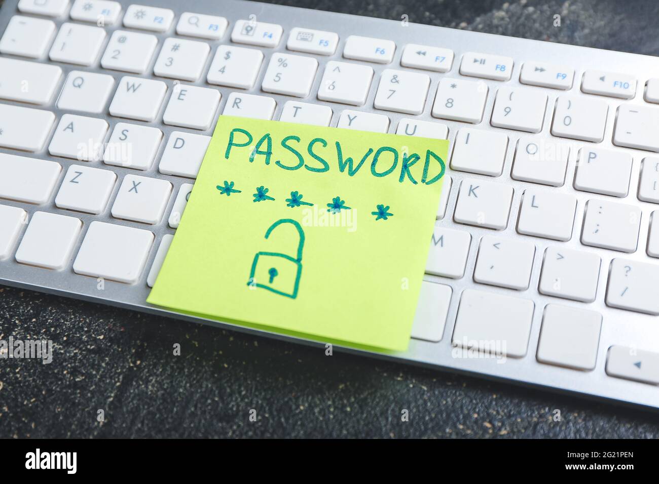 PC keyboard and paper with text PASSWORD on dark background. Hacking ...