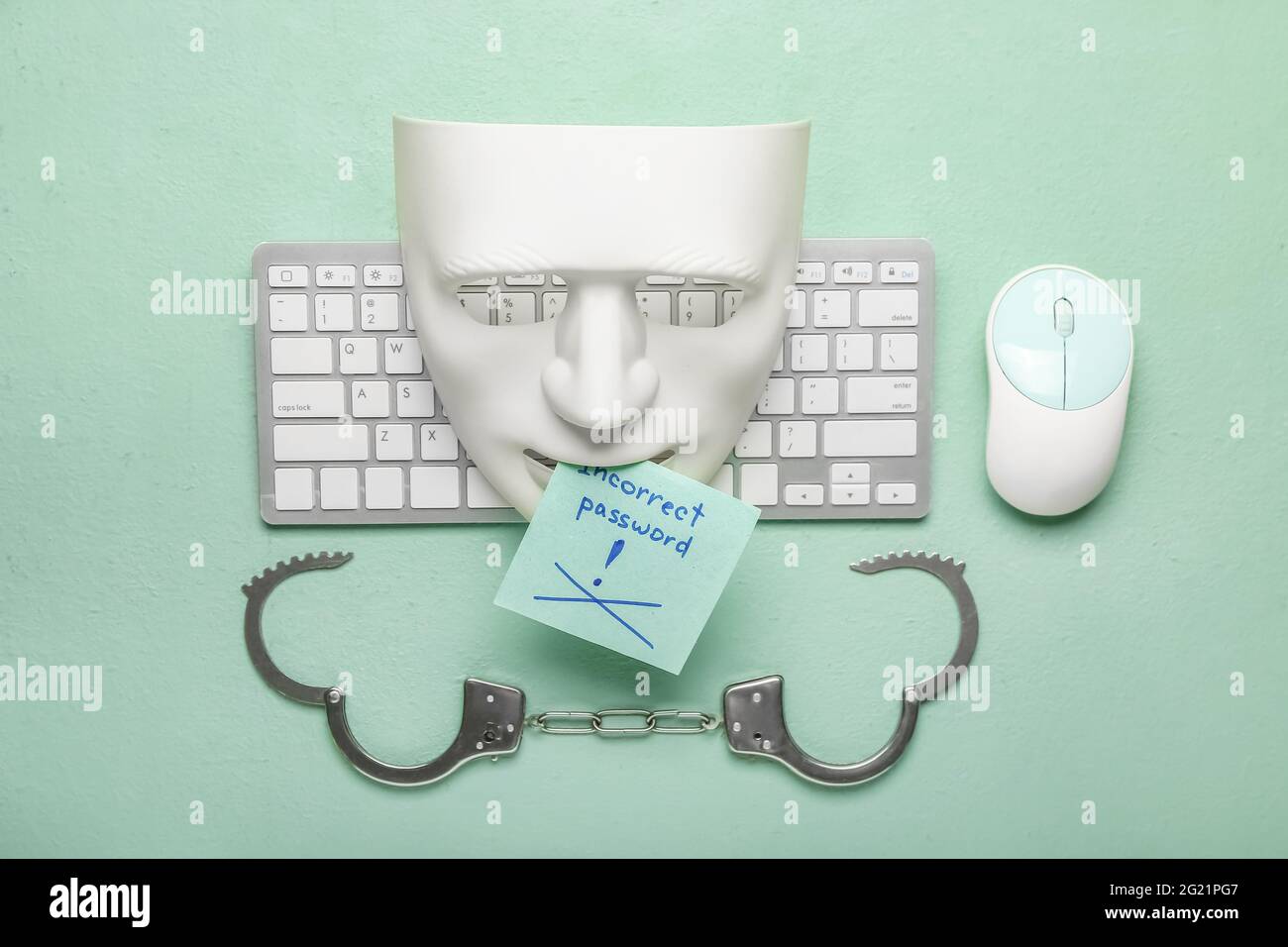 PC keyboard, mask and handcuffs on color background. Hacking concept ...