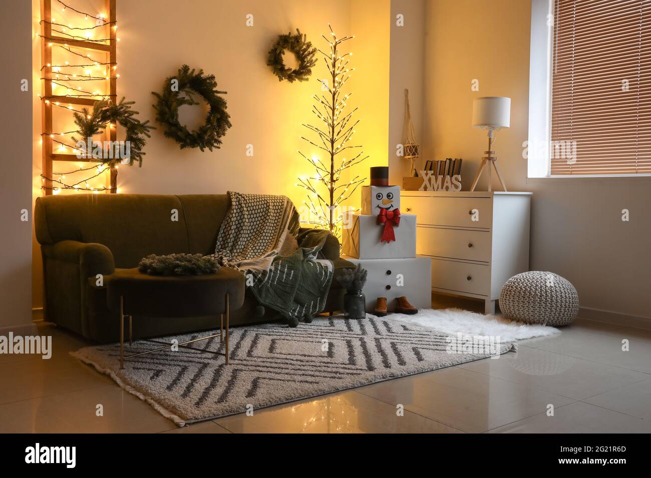 Interior of stylish living room with decorative snowman Stock Photo - Alamy