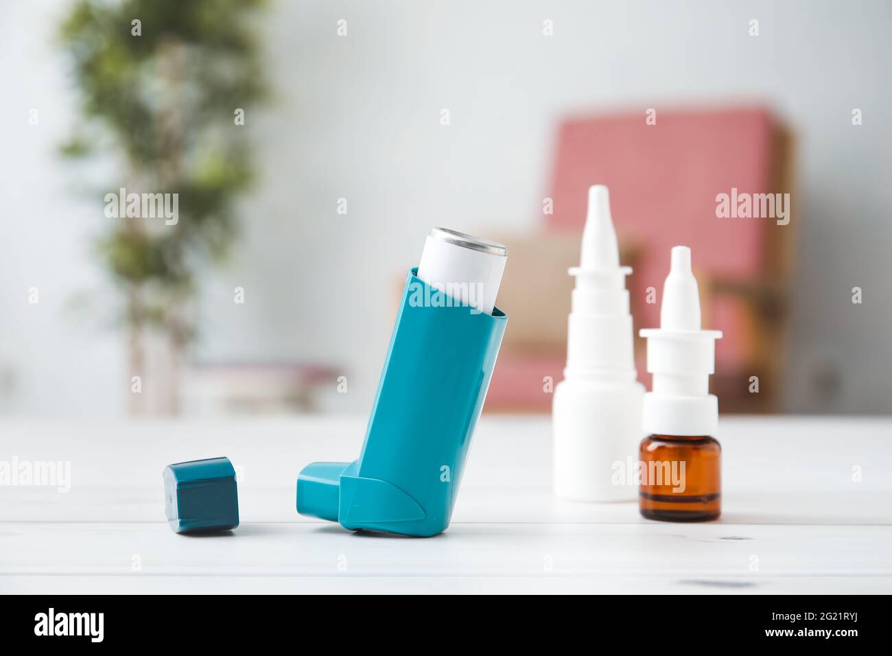 Modern inhaler on table at home Stock Photo - Alamy
