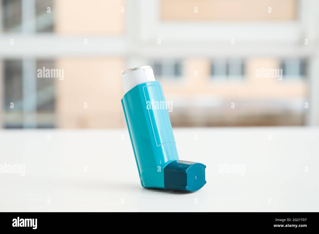 Modern inhaler on table near window, closeup Stock Photo - Alamy