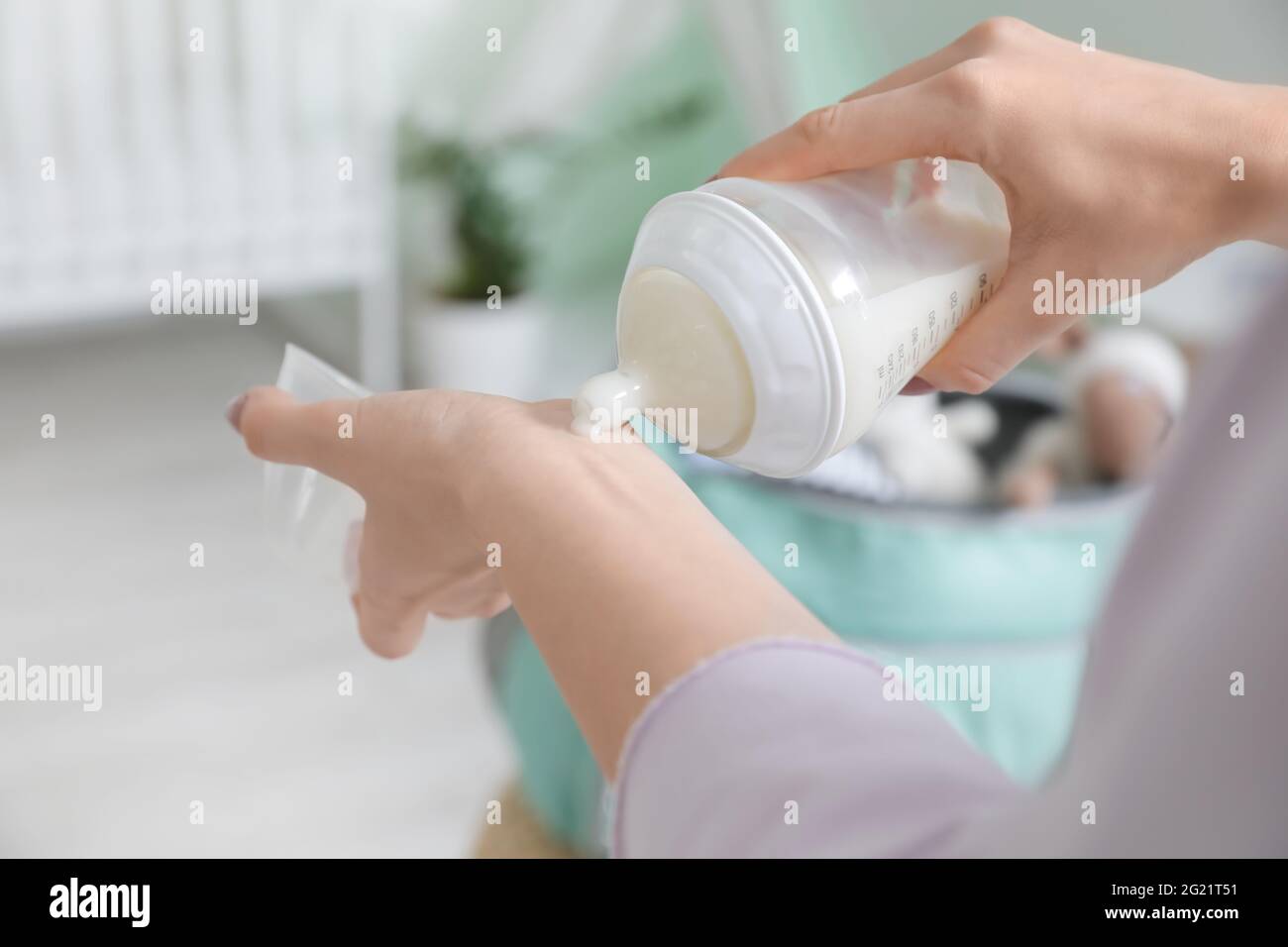 Baby bottle milk temperature hi-res stock photography and images - Alamy