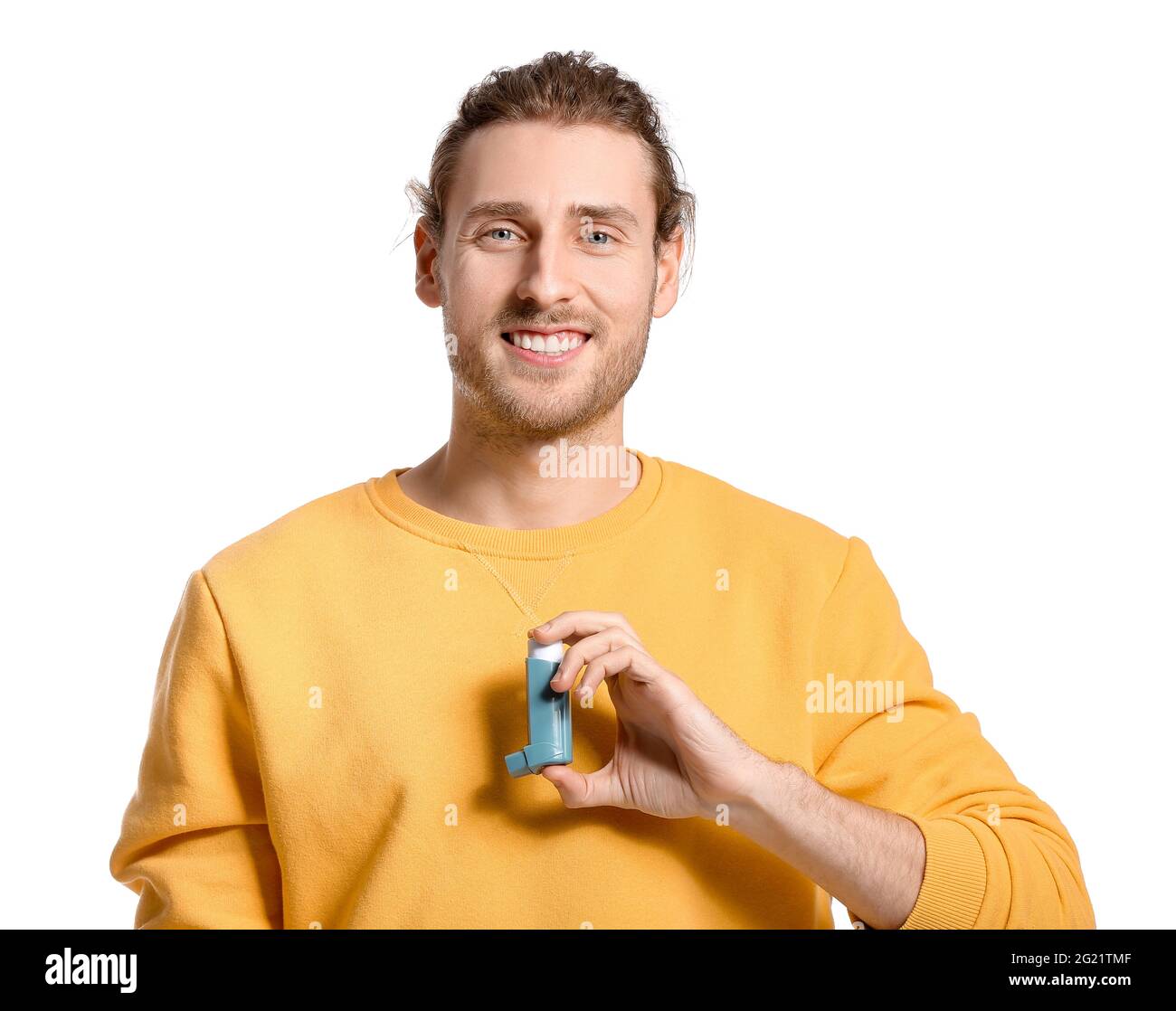 Young man with inhaler on white background Stock Photo - Alamy