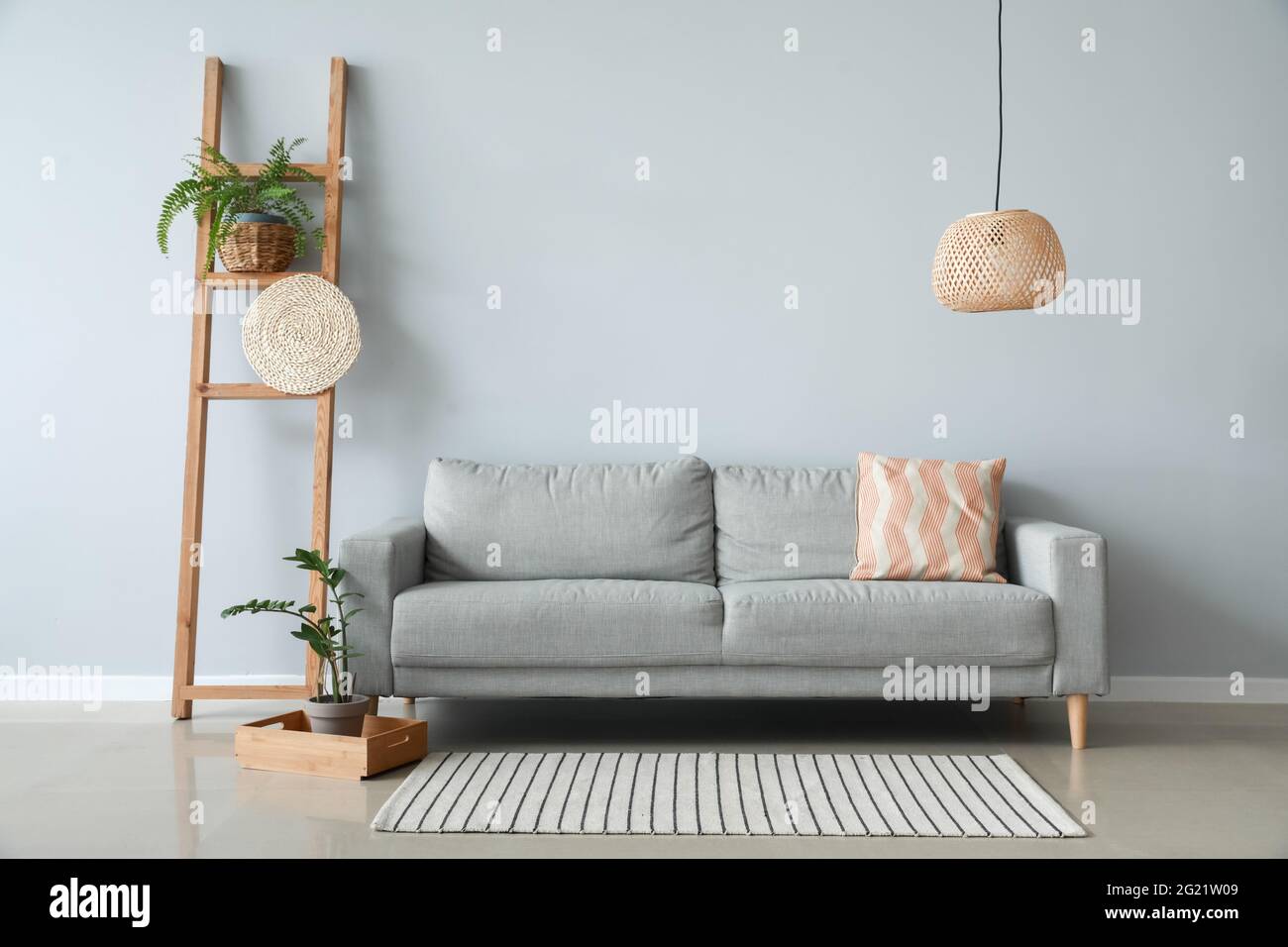 modern interior of living room with cozy sofa Stock Photo - Alamy