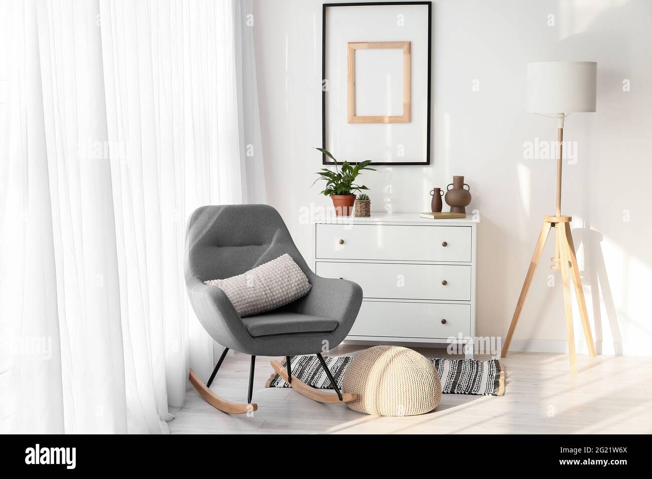 Interior of modern living room with armchair Stock Photo - Alamy