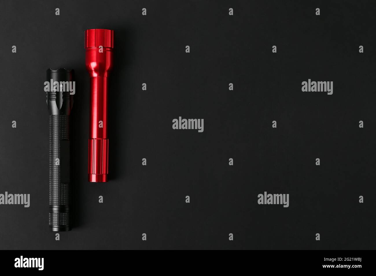 Modern flashlights on dark background Stock Photo - Alamy