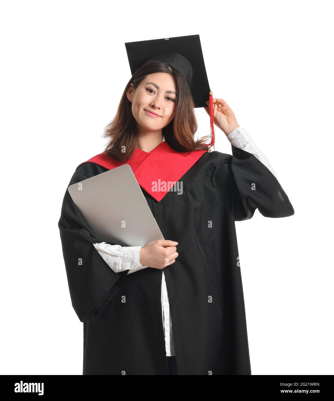 Female graduating student with laptop on white background Stock Photo ...
