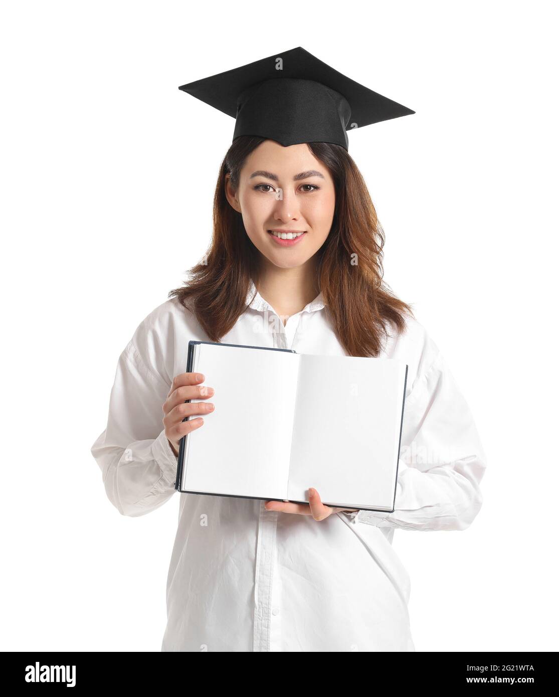 Female graduating student with book on white background Stock Photo - Alamy