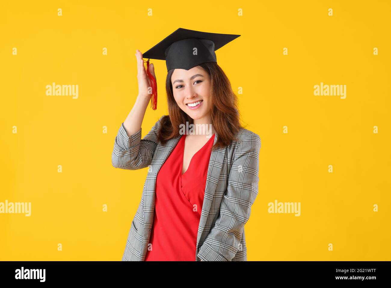 Female graduating student on color background Stock Photo - Alamy