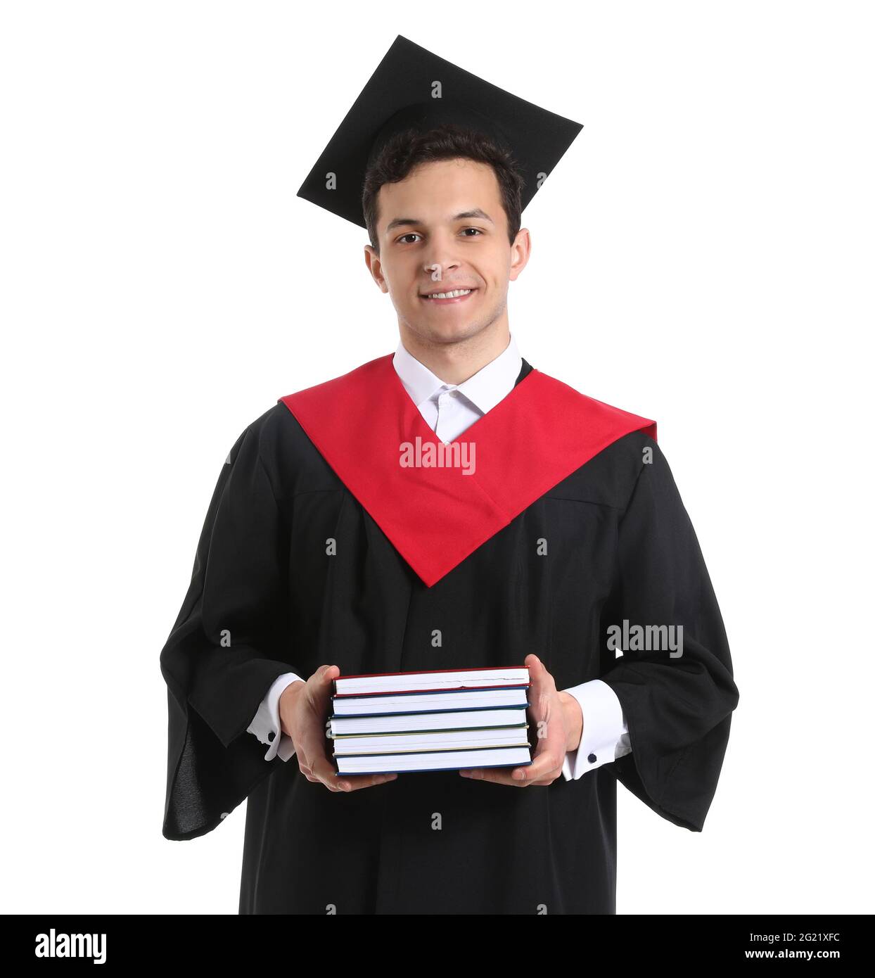 Male graduating student with books on white background Stock Photo - Alamy