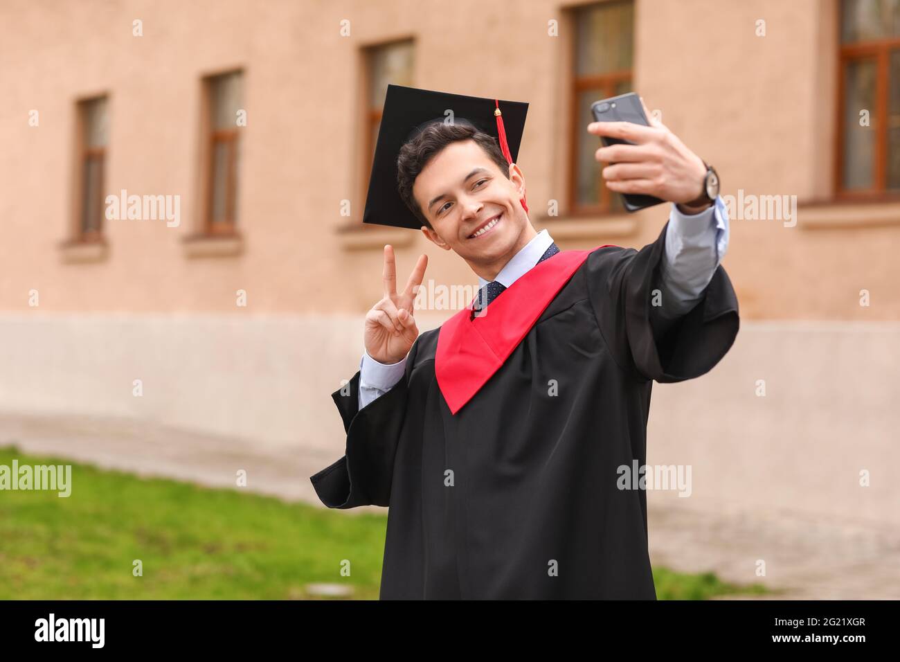 Male graduating student taking hi-res stock photography and images - Alamy