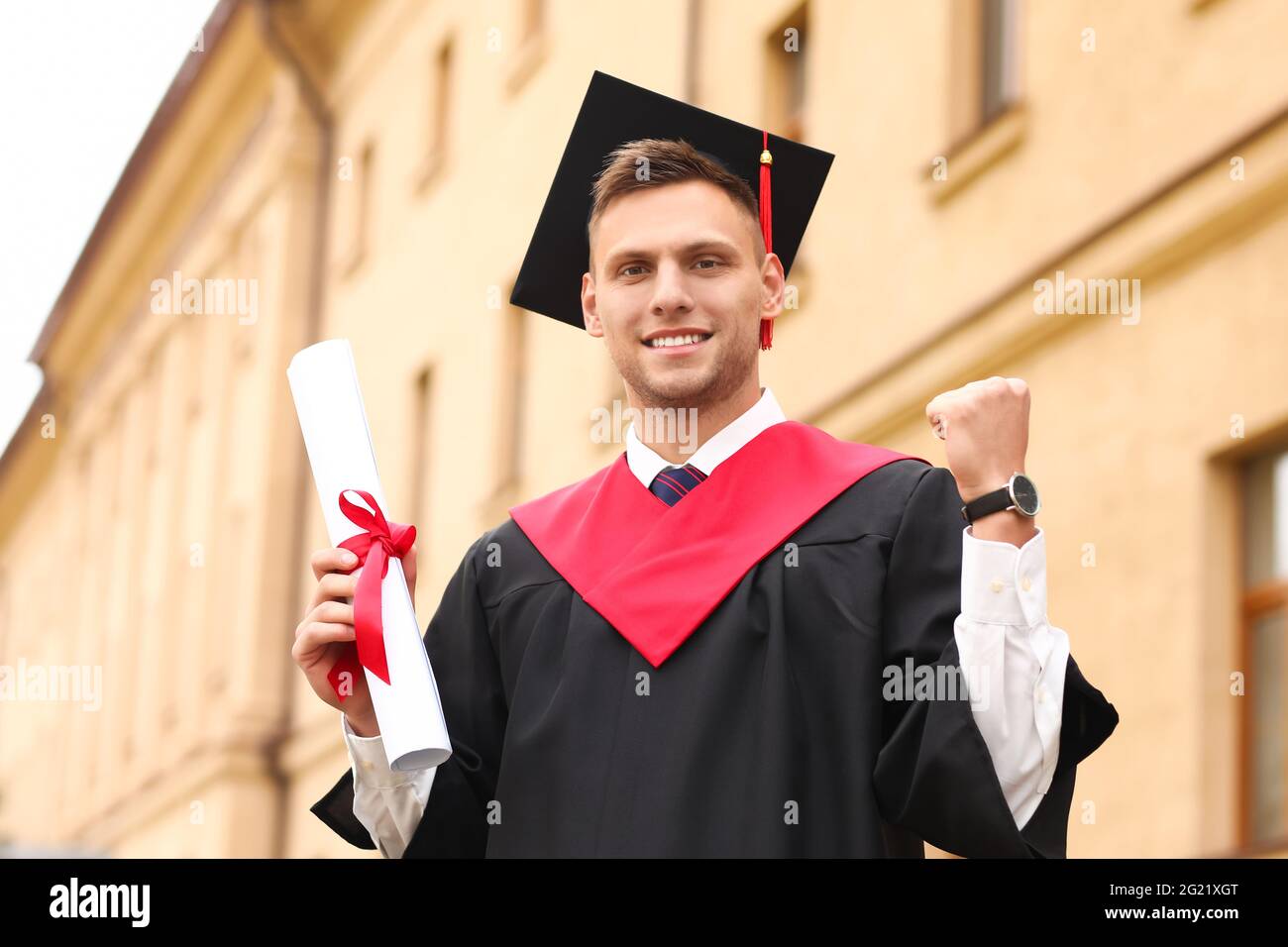 Portrait of happy male graduating student outdoors Stock Photo - Alamy