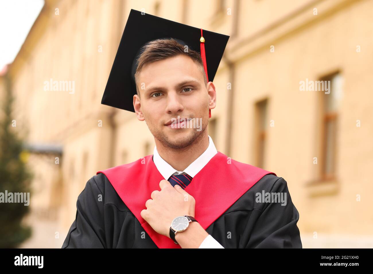 Portrait of male graduating student outdoors Stock Photo - Alamy