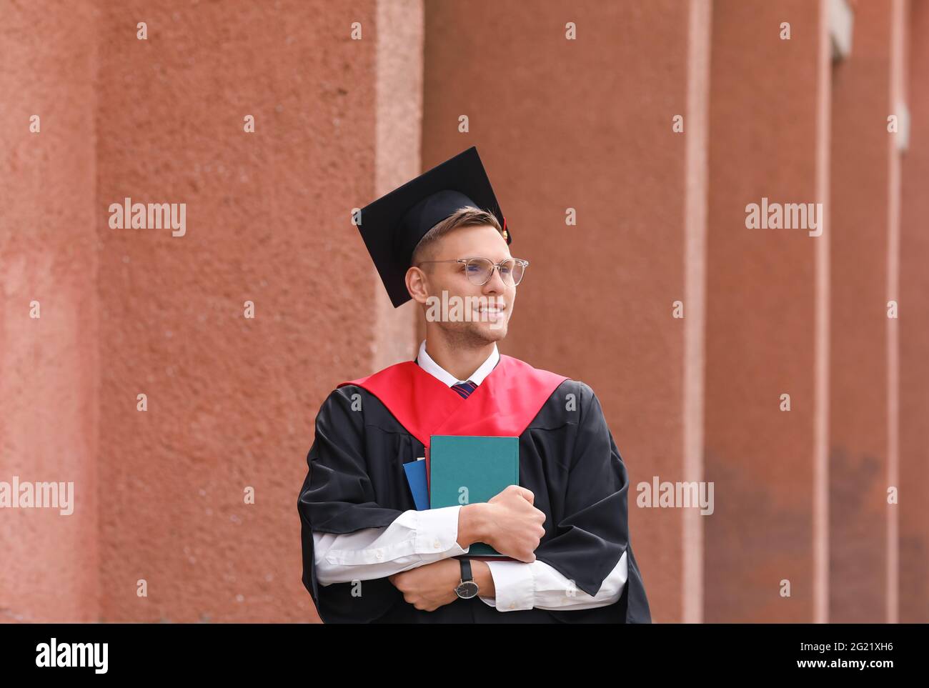 Portrait of male graduating student outdoors Stock Photo - Alamy