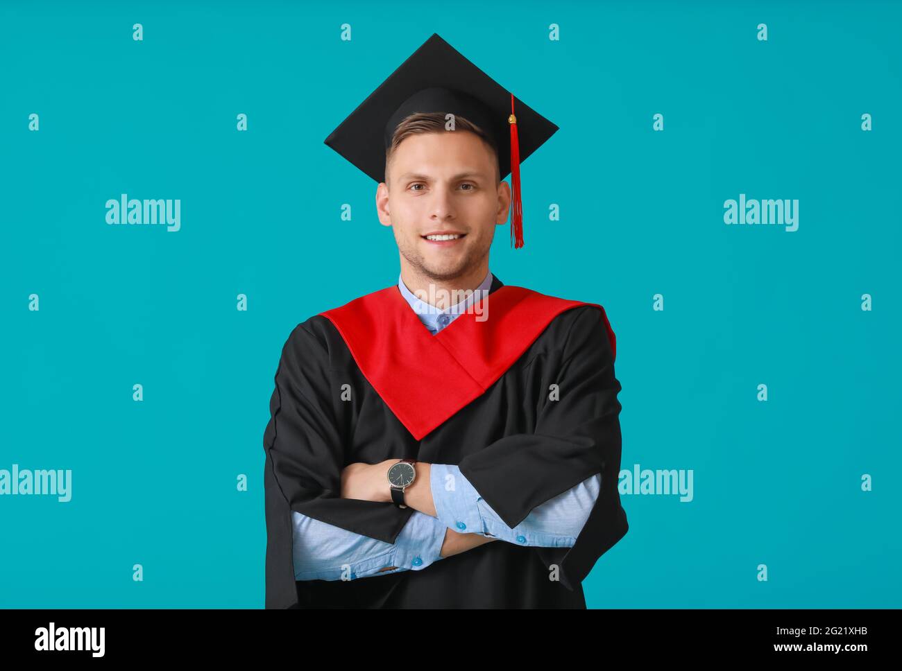 Male graduating student on color background Stock Photo - Alamy