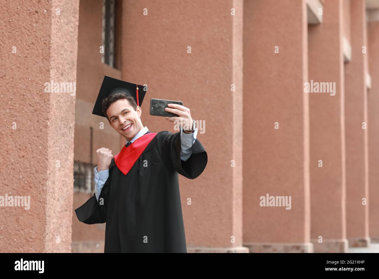 Male graduating student taking hi-res stock photography and images - Alamy